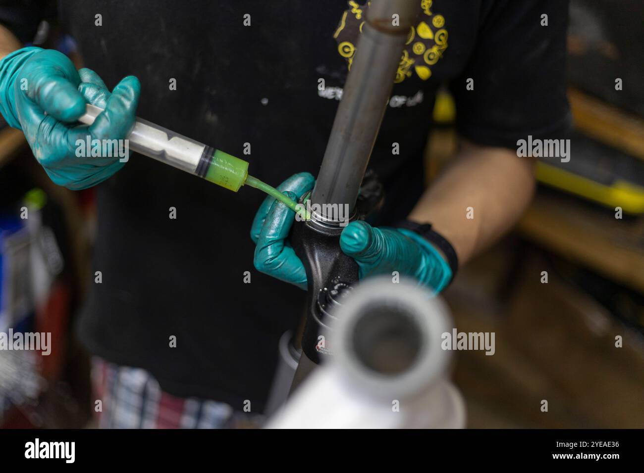 Applying grease to a bicycle steering fork Stock Photo - Alamy