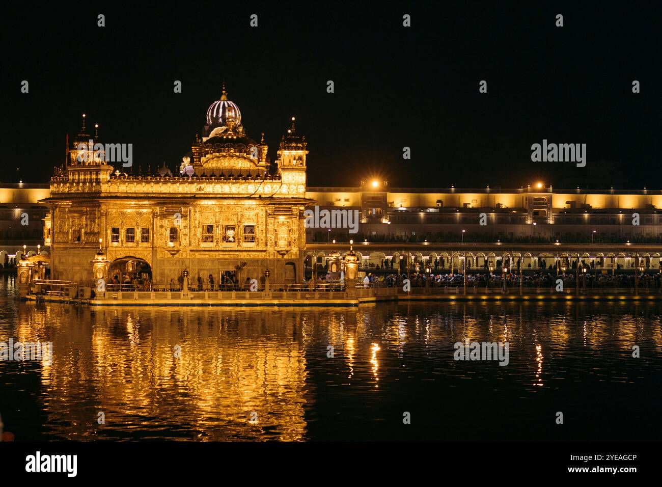 Golden Temple, a Sikh Gurdwara with pool of water at night, in Amritsar ...