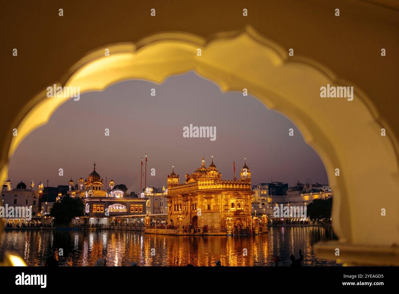 Golden Temple, a Sikh Gurdwara with pool of water and framed by a ...
