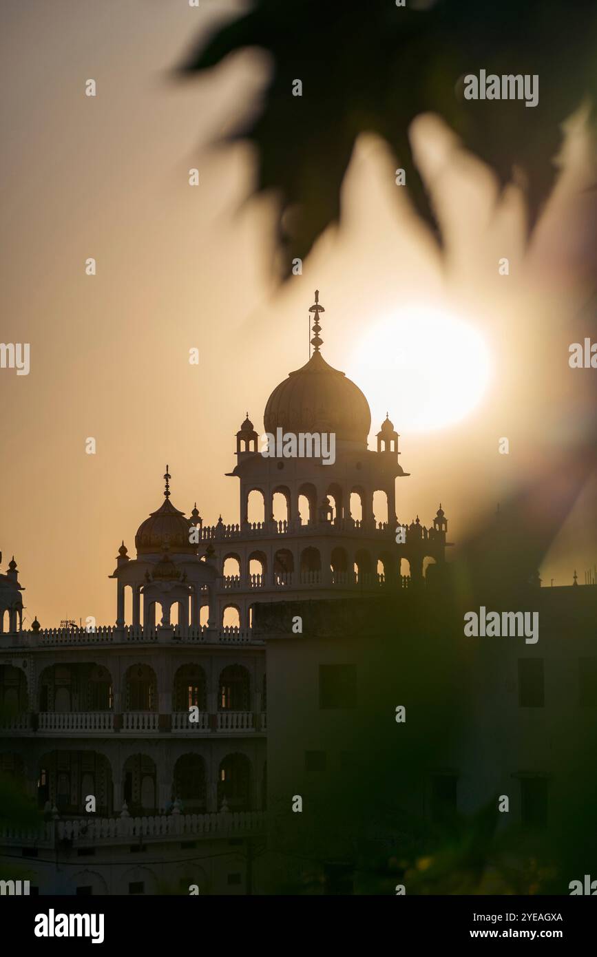 Gurudwara Maharani Chand Kaur in silhouette at sunset in Jammu, India ...
