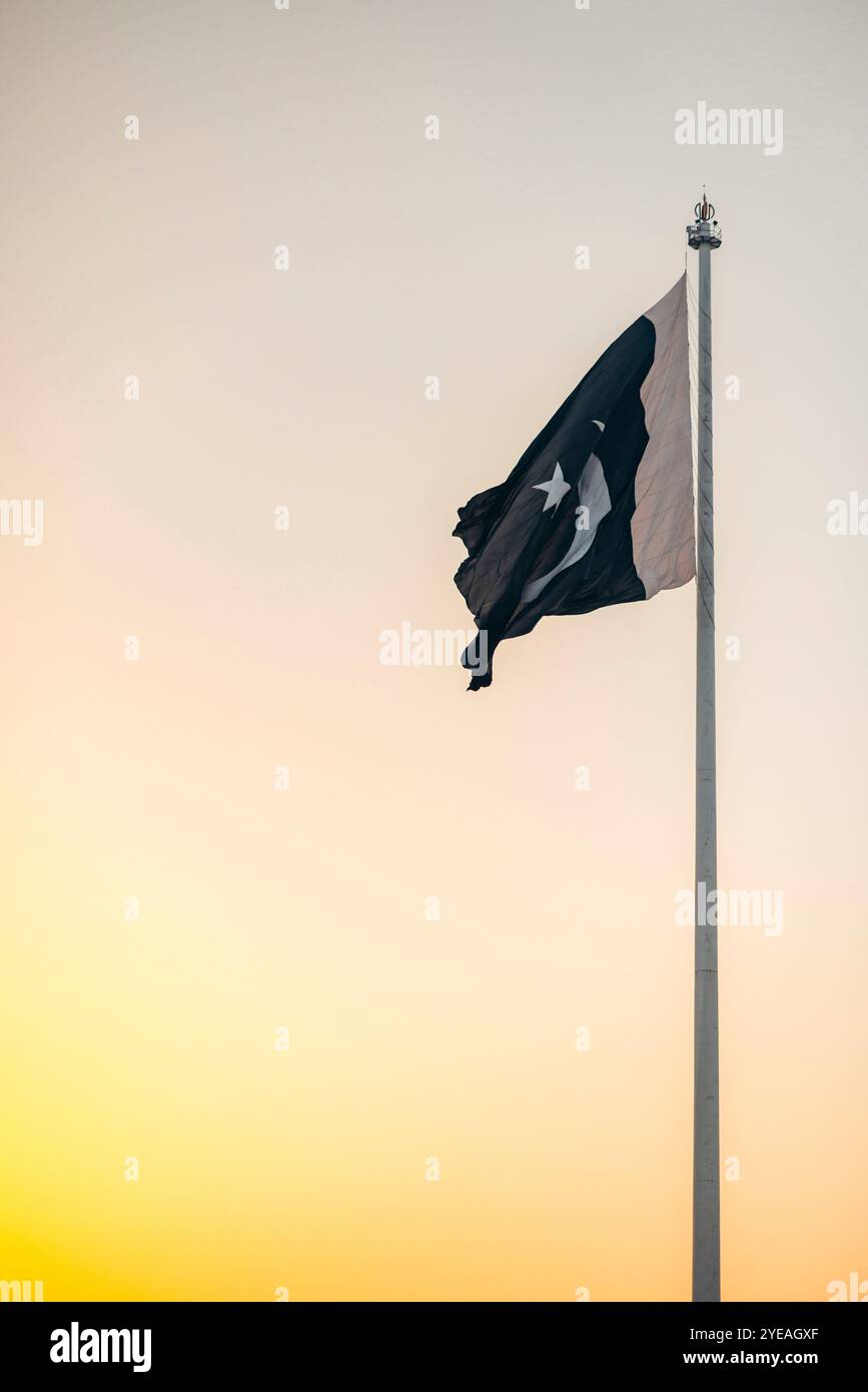National flag of Pakistan in a sunset sky at the Attari - Wagah Border ...