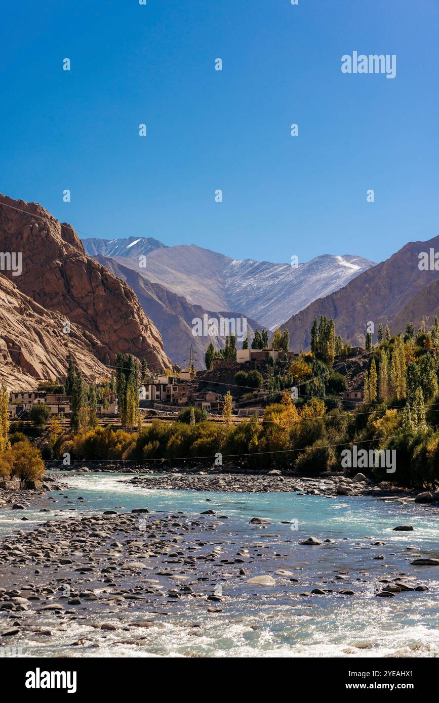 Picturesque view of a town in Ladakh, India, with flowing river and ...