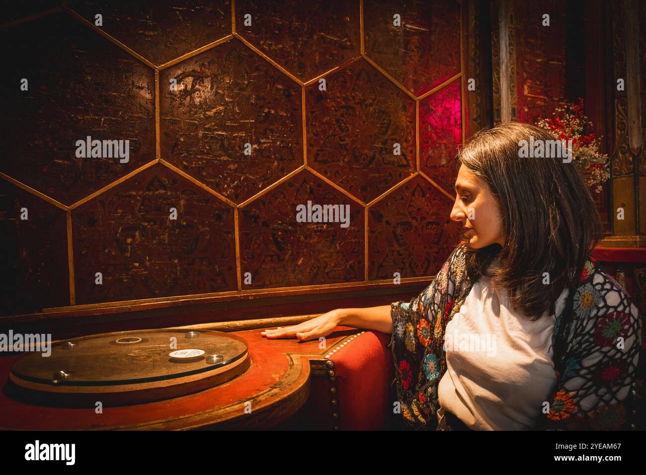 Yerevan, Armenia - 19th october, 2024: tourist touch unique old original design wooden table ...