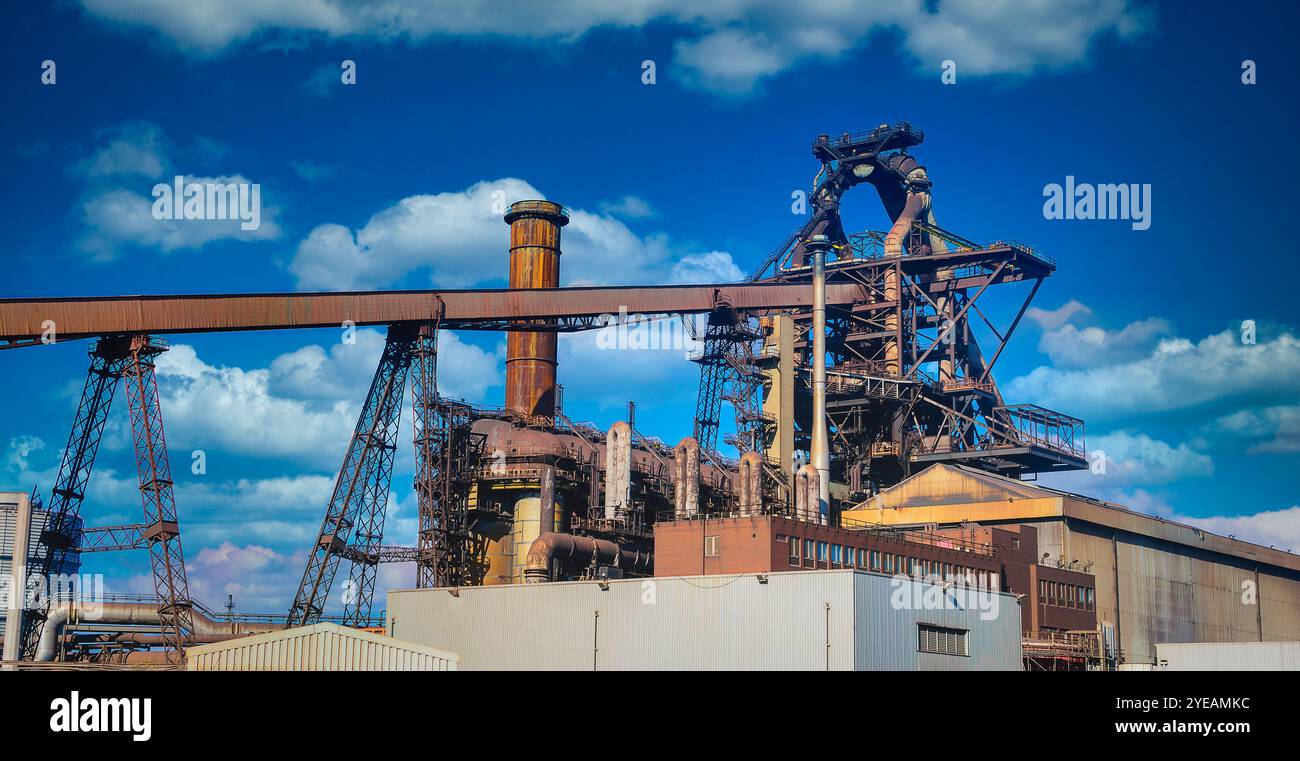 Blast furnace plant on blue sky background in steel industry, UK Stock ...