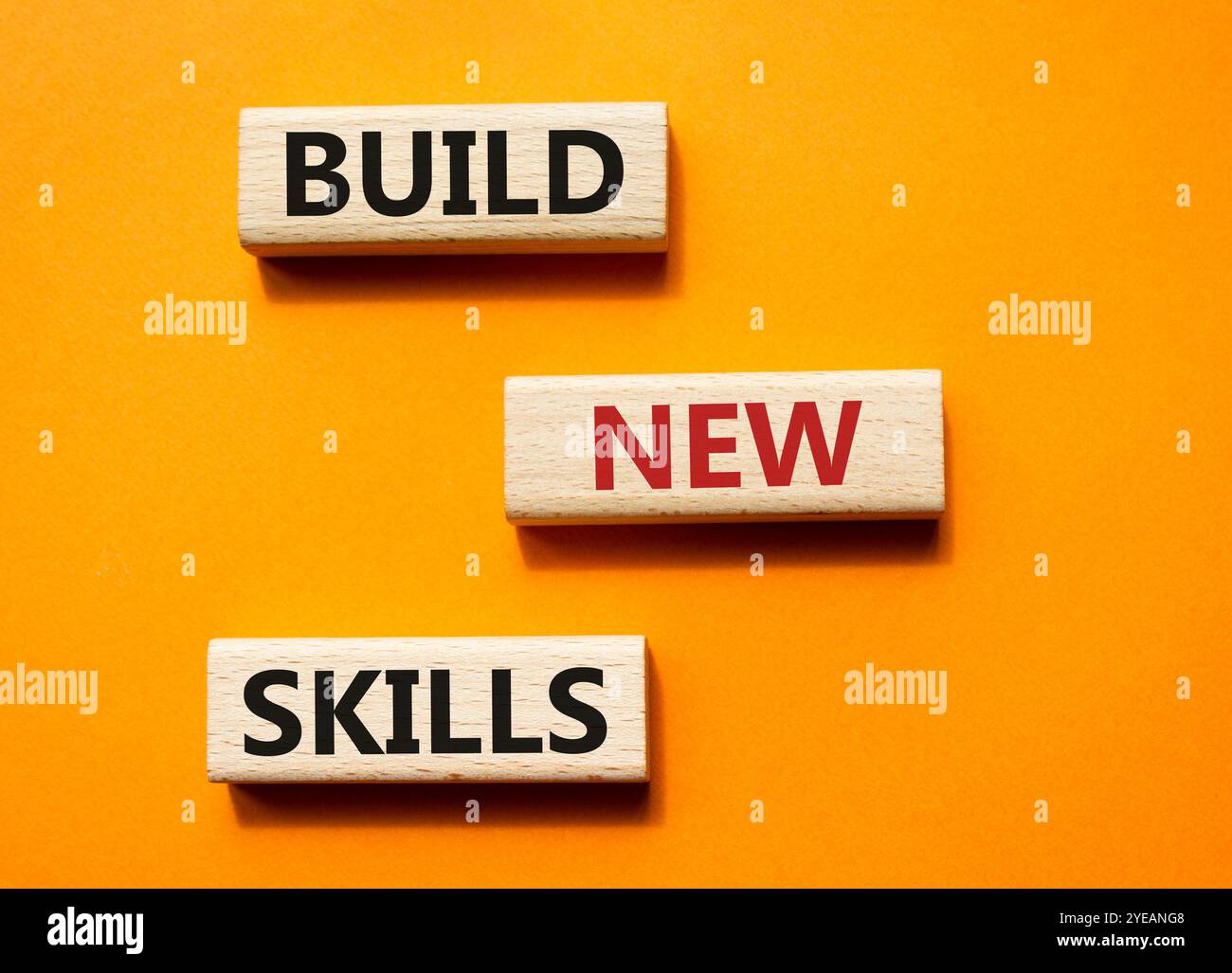 Build New skills symbol. Concept word Build New skills on wooden blocks ...