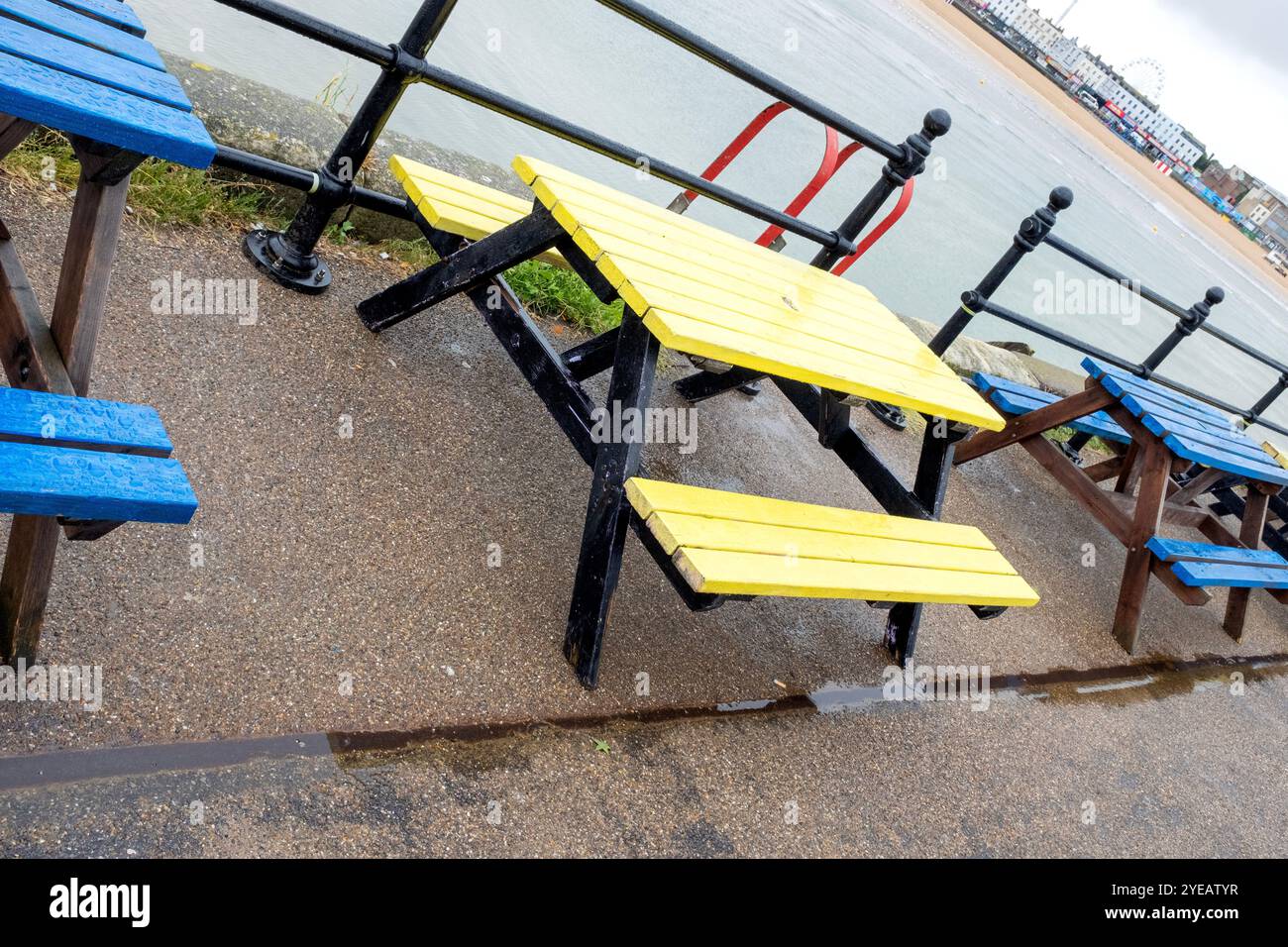 Colourful blue and yellow benches on the pier in Margate Stock Photo - Alamy