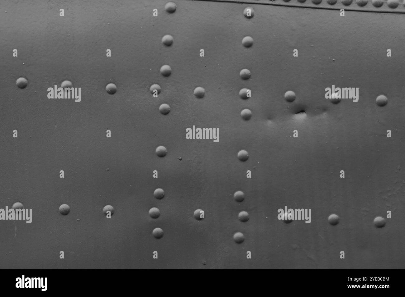 The fuselage skin of an old military aircraft with rivets. Close-Up of ...