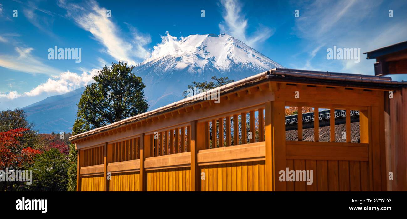 Mt. Fuji behind house with autumn foliage at sunset in Fujikawaguchiko ...