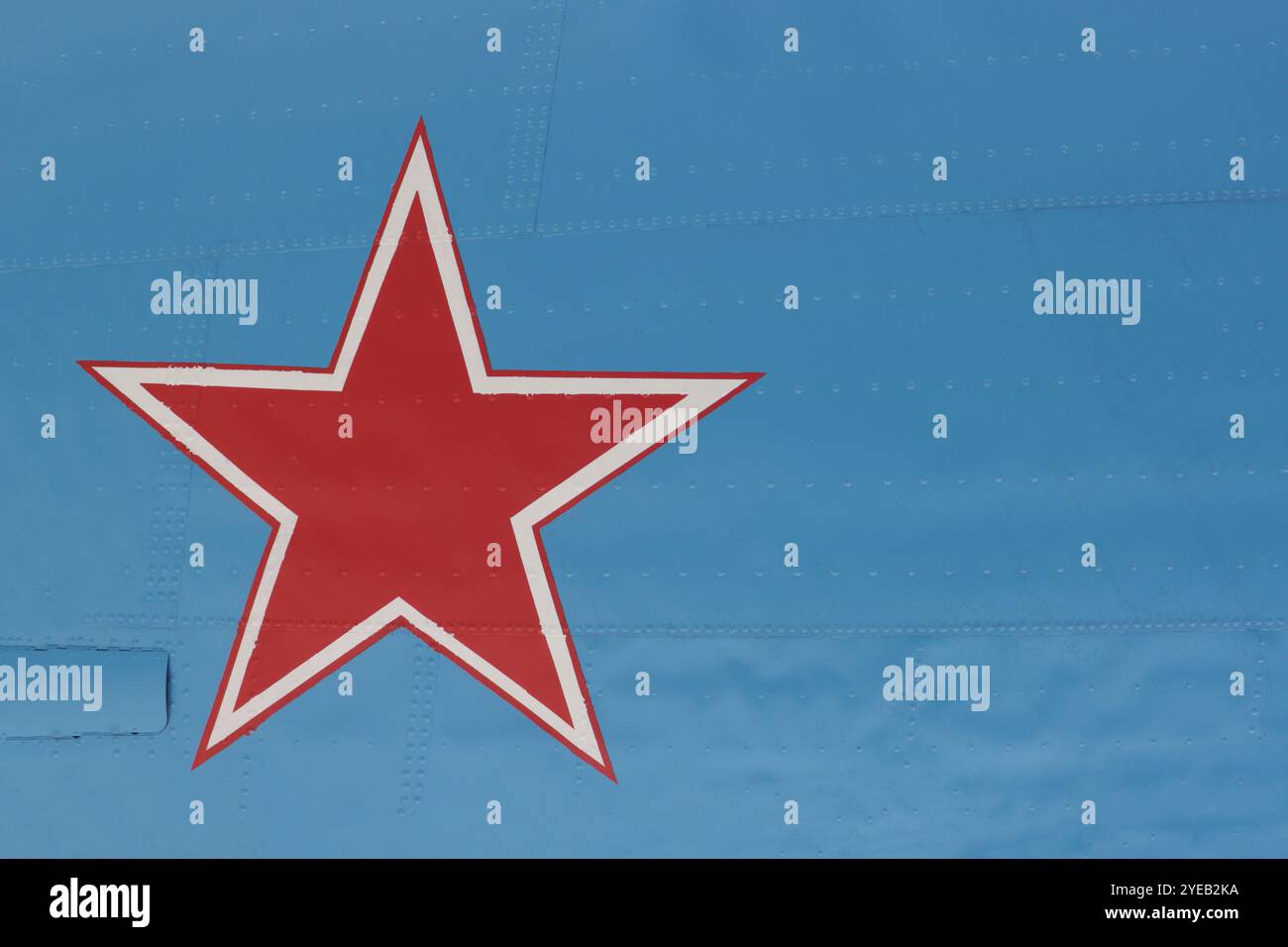 An army star with a white border on a green background of metal plating ...