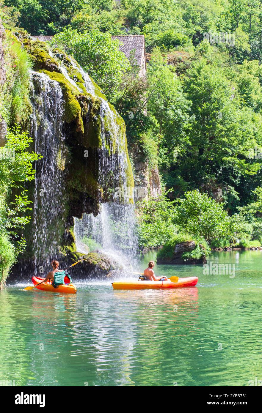 Canoes and waterfall of Saint-Chély-du-Tarn village in the valley of ...