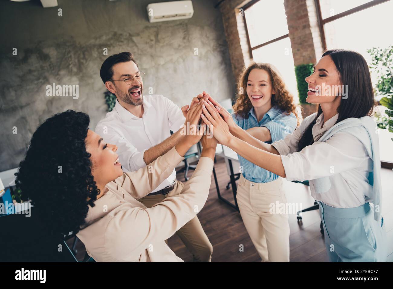 Photo of successful glad joyful happy people hands touch achieve ...