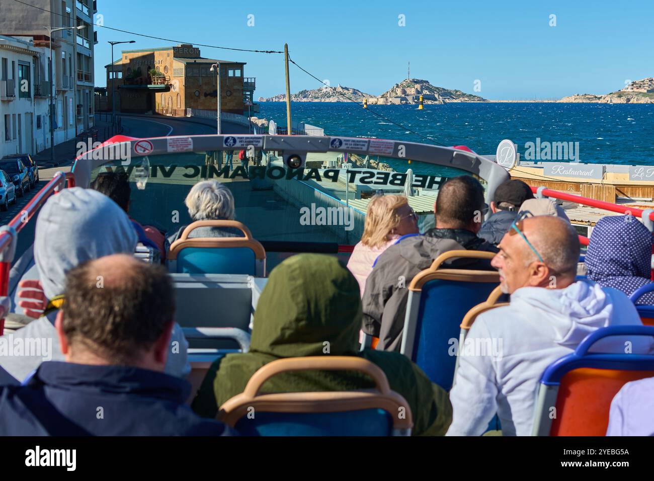 Marseille. France -October 30,2024: Tourists on a sightseeing bus enjoy ...