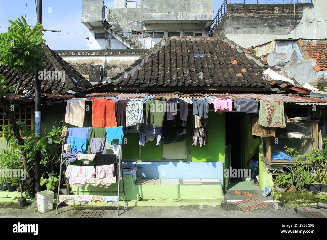 Residents use their roof tile to dry their clothes. Urban communities will use their limited ...