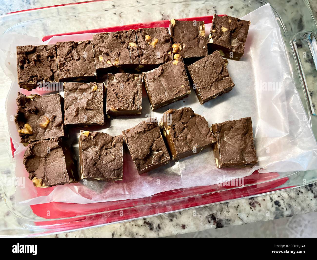 A container full of bite sized squares of homemade Chocolate Fudge with ...