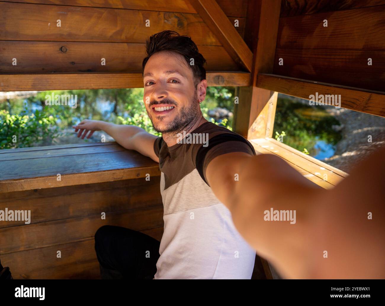 young adult man taking a selfie of himself smiling Stock Photo - Alamy