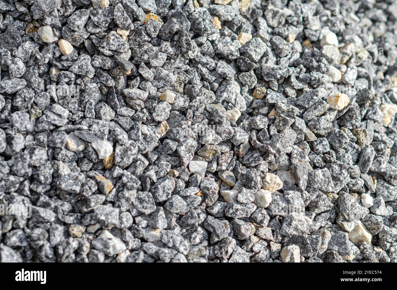 Embankment of gray gravel with small jagged edges. Abstract surface ...