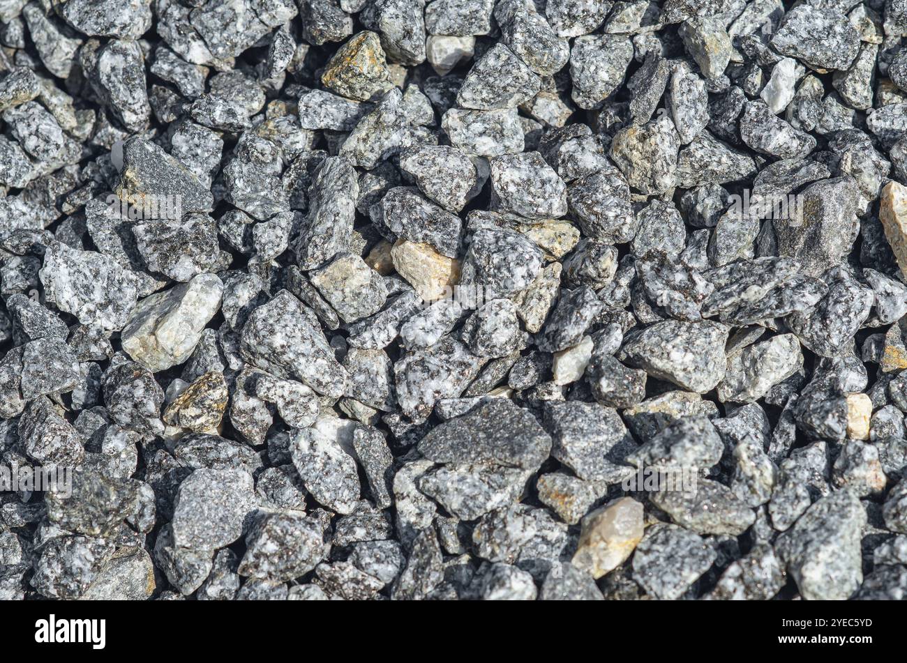 Gray gravel with small jagged edges creating an abstract surface for ...