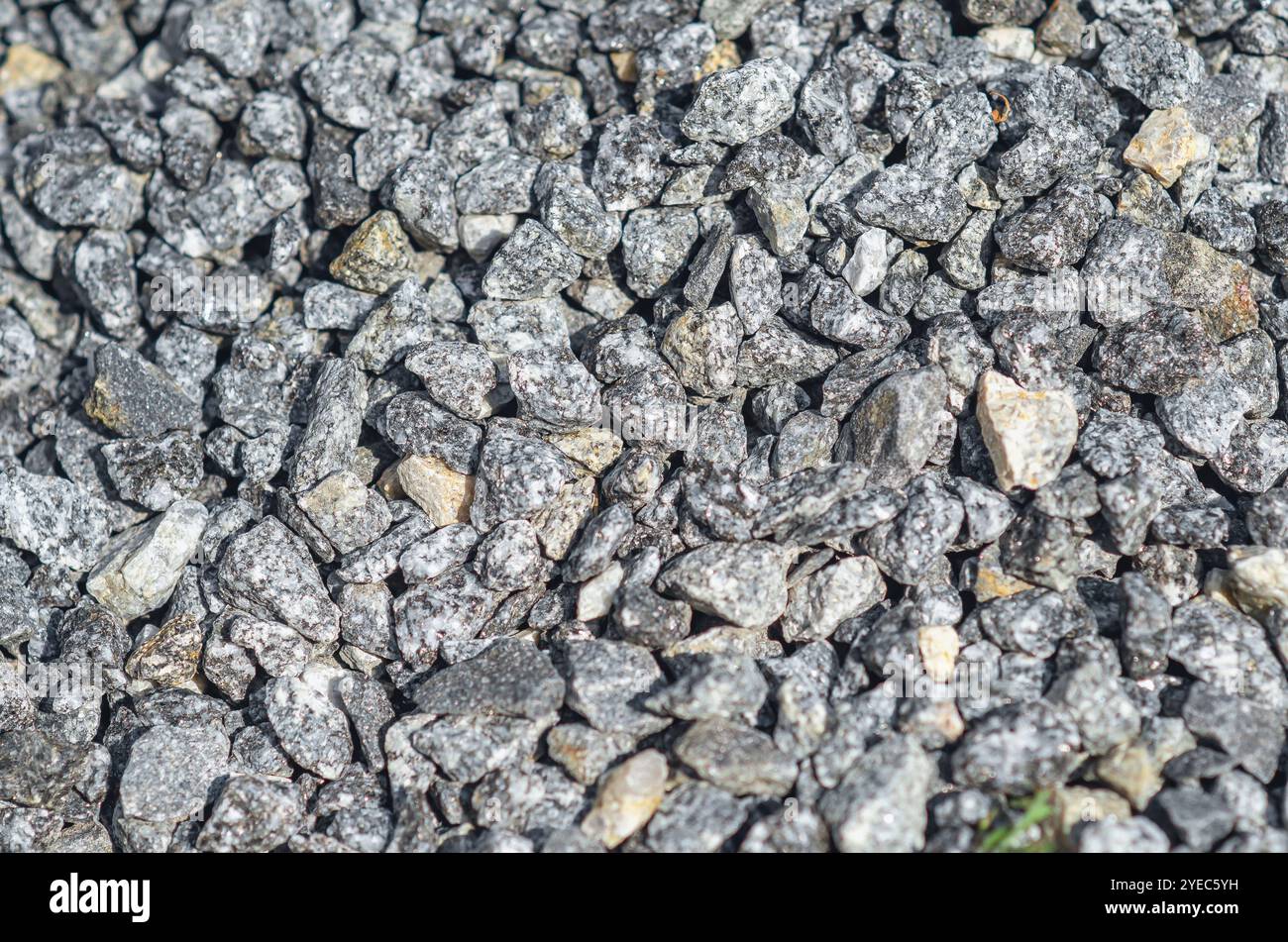 Gray gravel with small jagged edges creating an abstract surface for ...