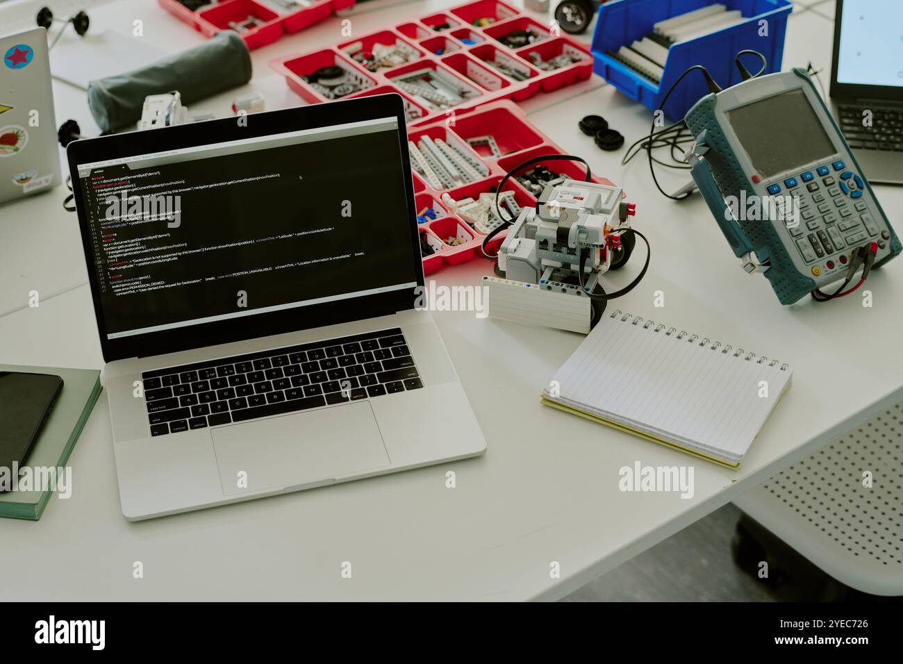 High angle shot of laptop with codes on screen and details to make ...