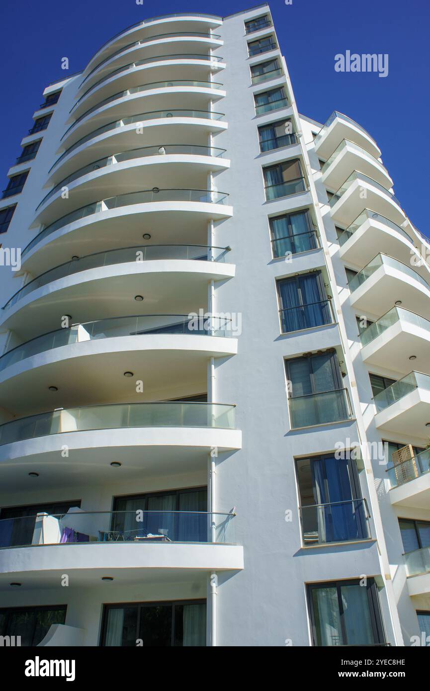 A striking high-rise showcases contemporary architecture with elegant ...