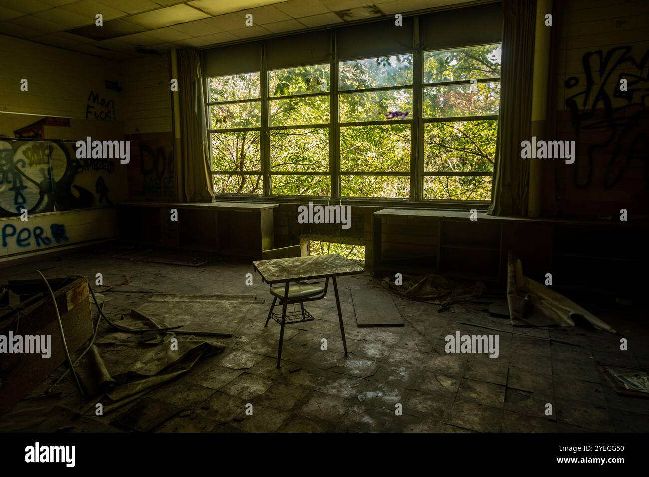 Photographs of abandoned and eerie buildings with graffiti featuring a ...