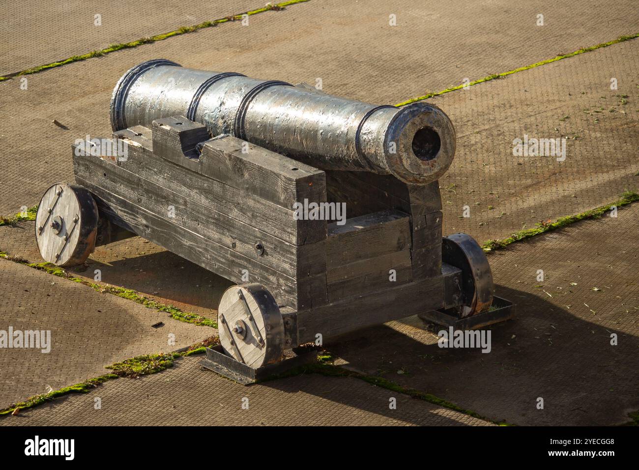 Old cannon. Antique iron cannon on wheels Stock Photo - Alamy