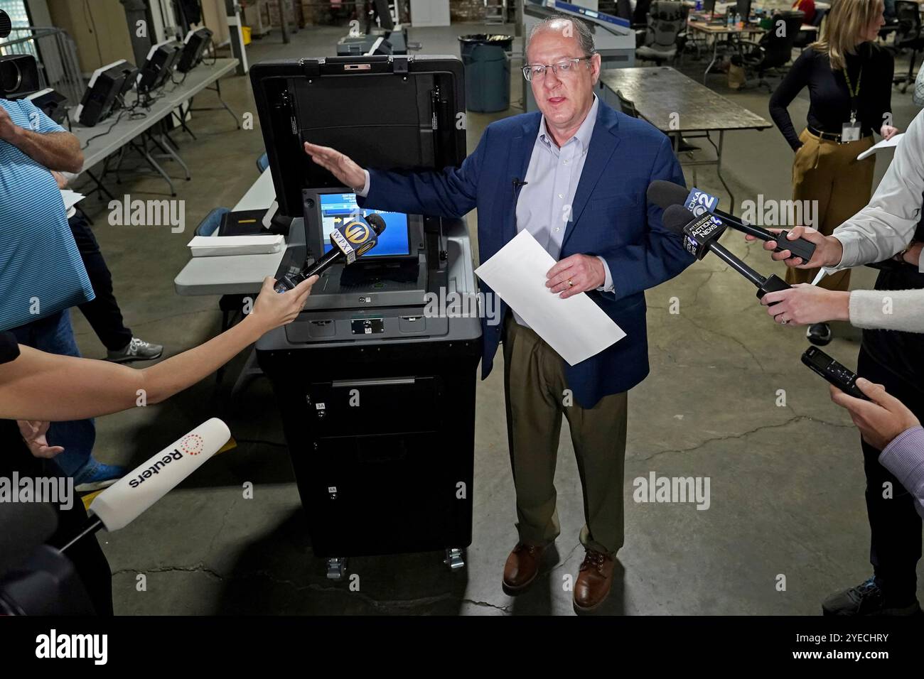 Allegheny County Elections Division Manager David Voye demonstrates a ...