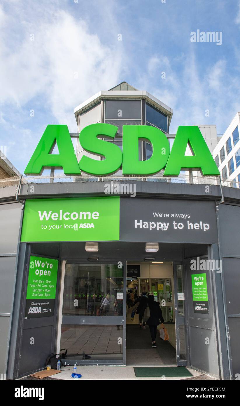 front entrance and large logo or badge of an Asda supermarket in ...