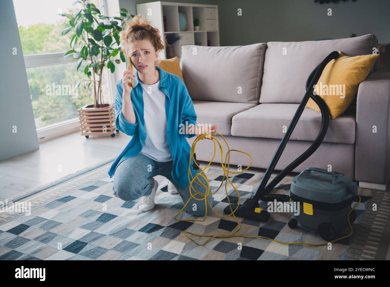 Full size photo of young ginger girl nervous repair vacuum cleaner talk ...