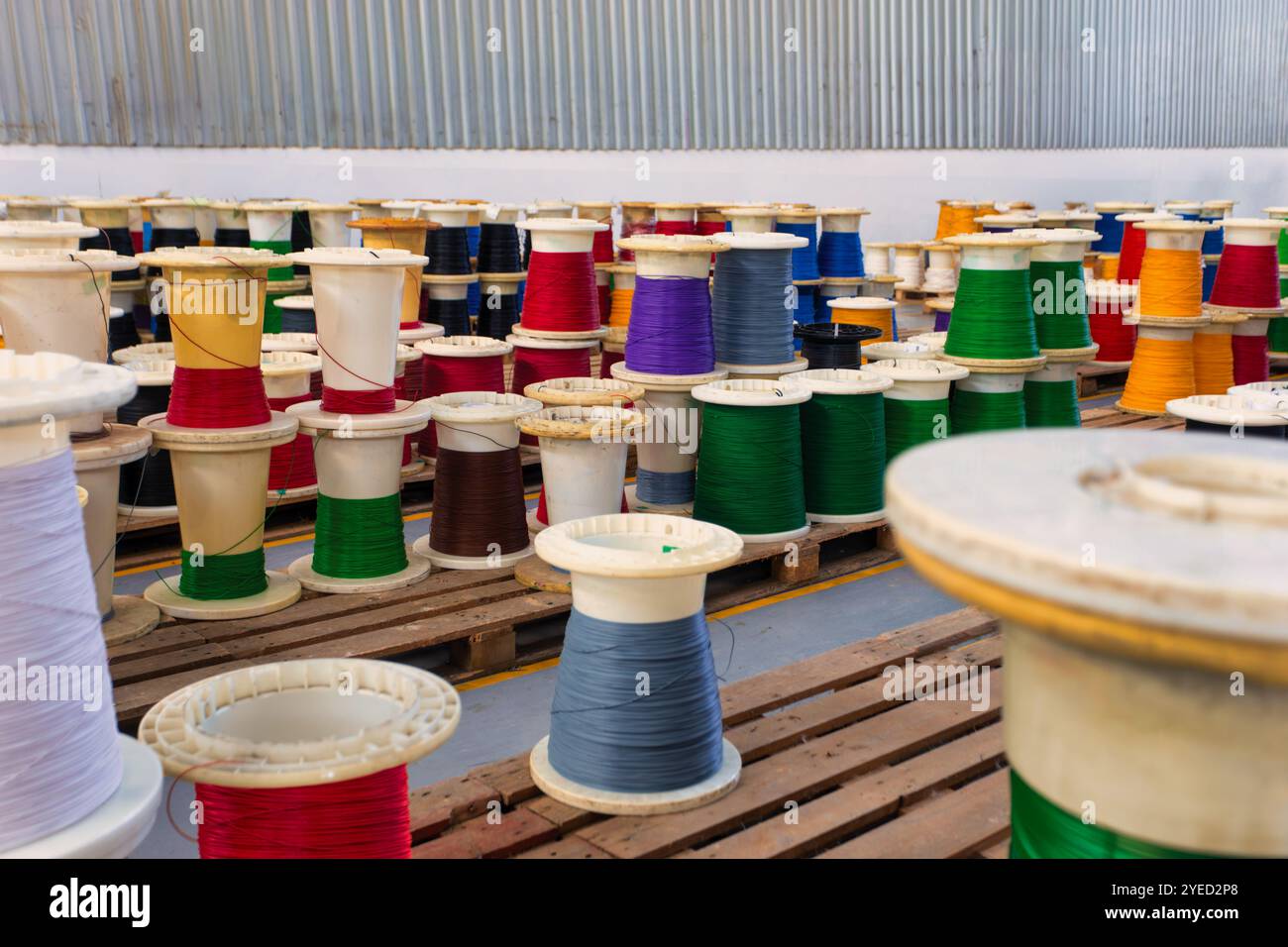 car electric harnesses factory ,rolls of cable wire, stored in a ...