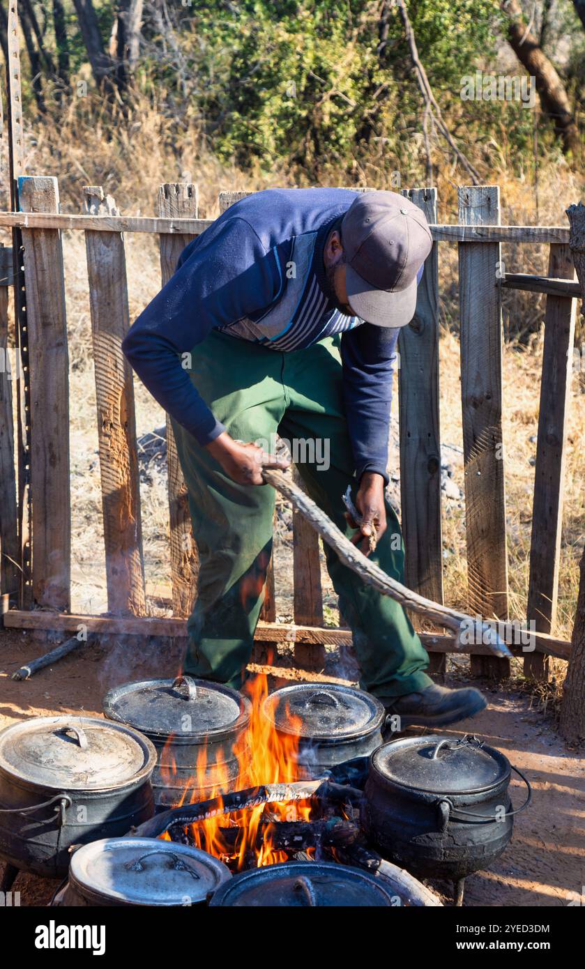 cauldron three legged pot outdoors bulk cooking, african man street ...