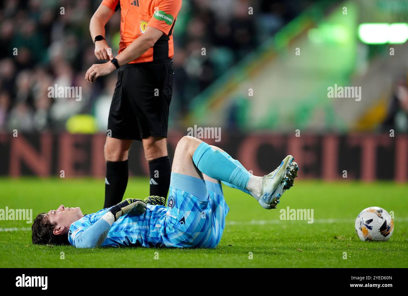 Dundee goalkeeper Jon McCracken on the floor after a collision during ...