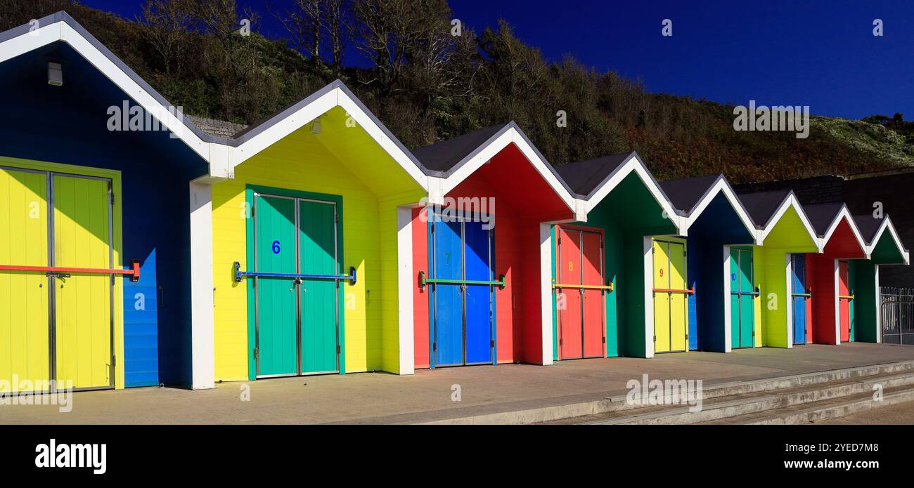 Colourful painted wooden beach huts at Barry Island seafront, South ...