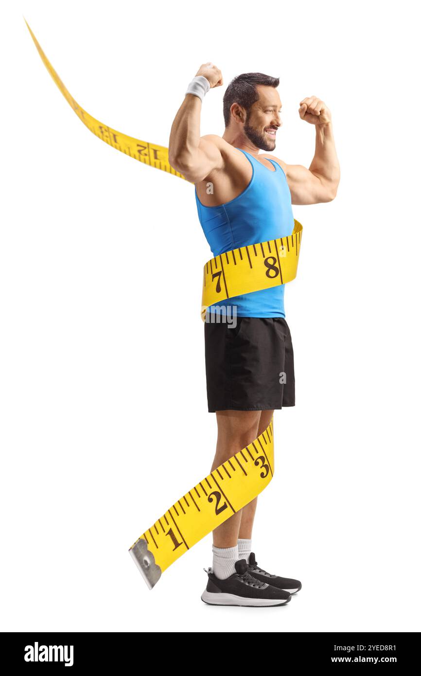 Fit man in sportswear flexing arm muscles and measuring body ...