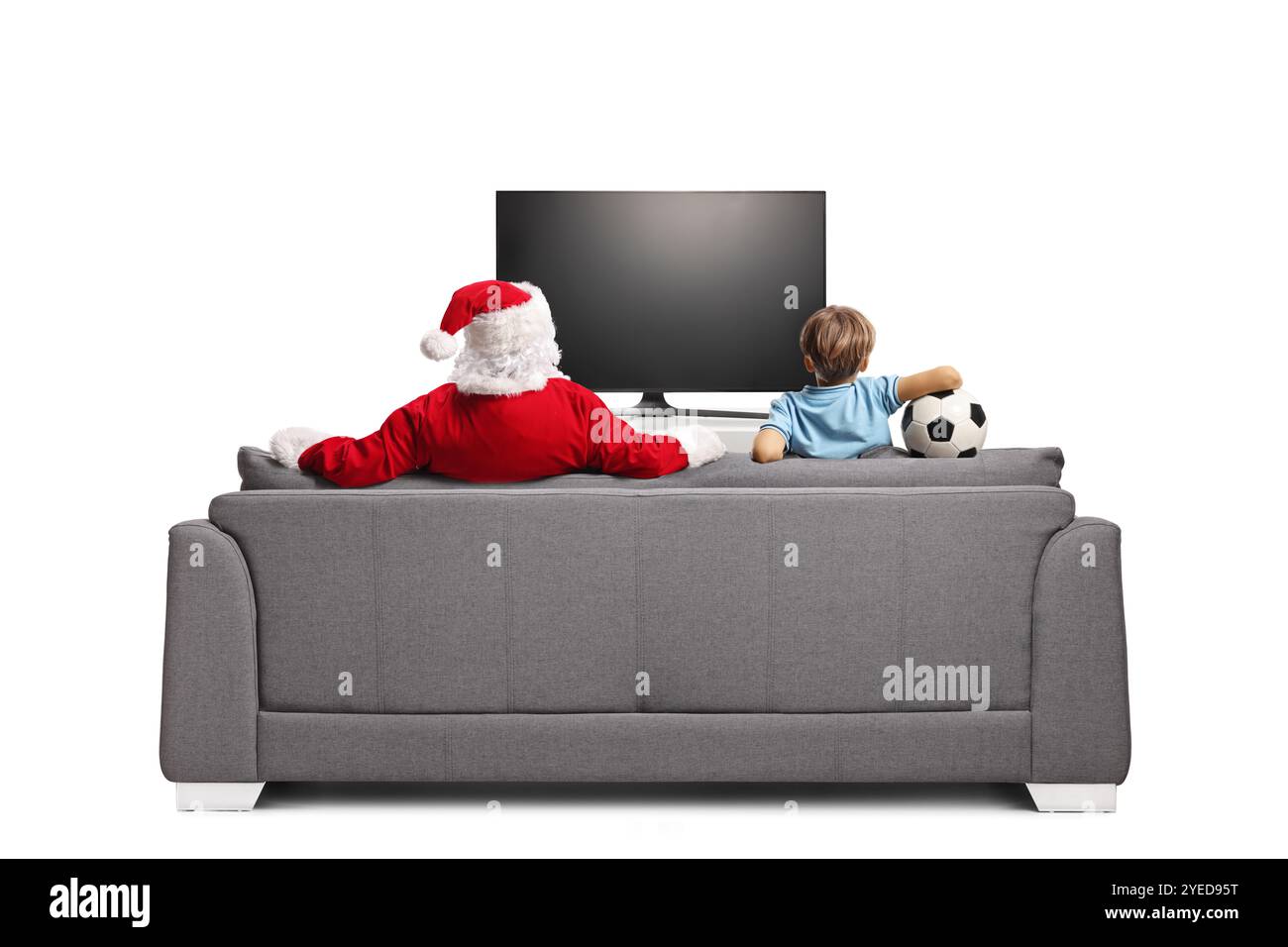 Boy holding a football and watching tv with Santa Claus isolated on ...