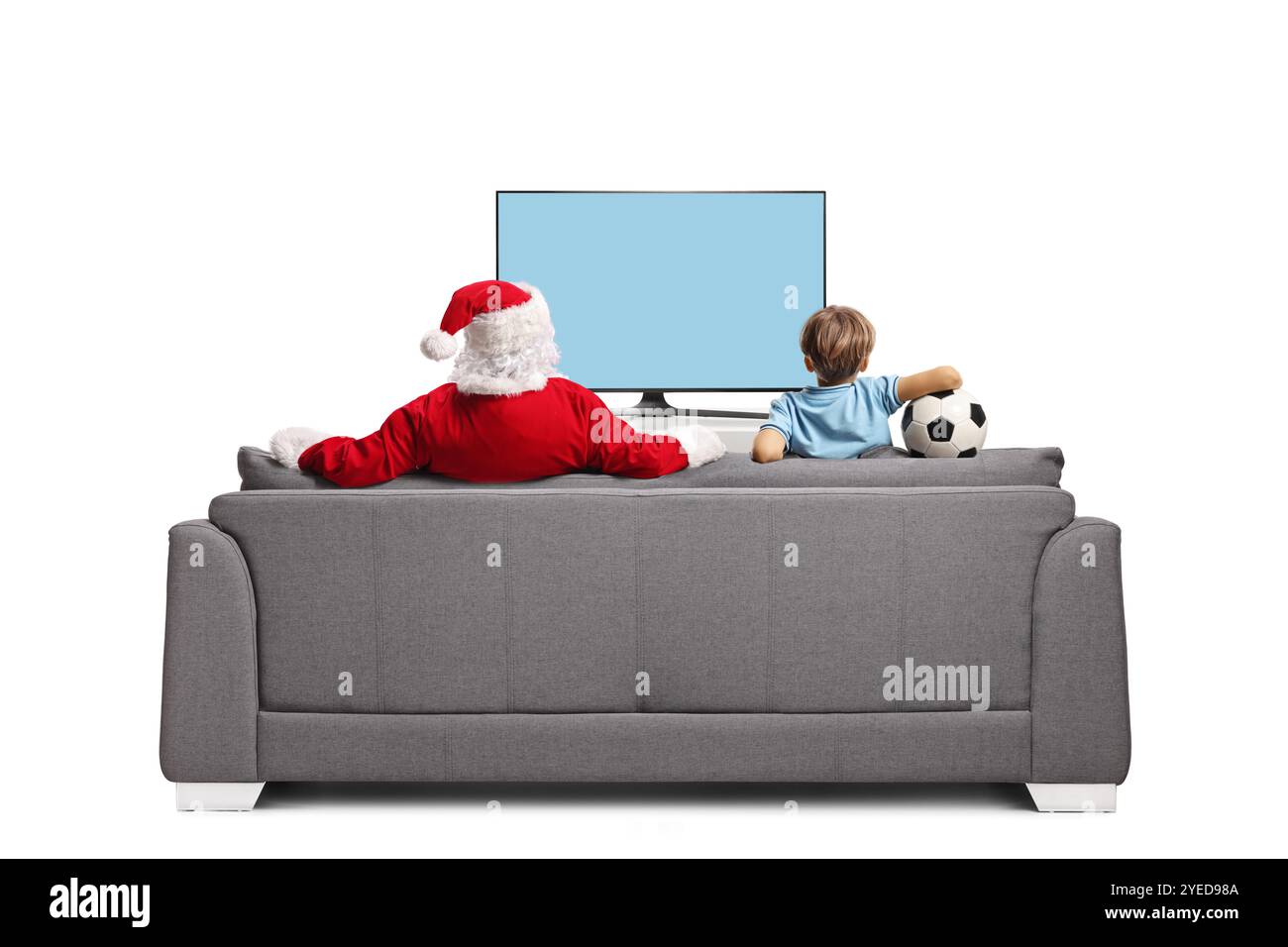 Santa claus in front of tv watching a football match with a kid ...