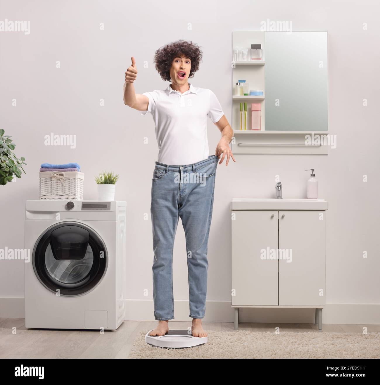 Fit man standing scale in hi-res stock photography and images - Alamy