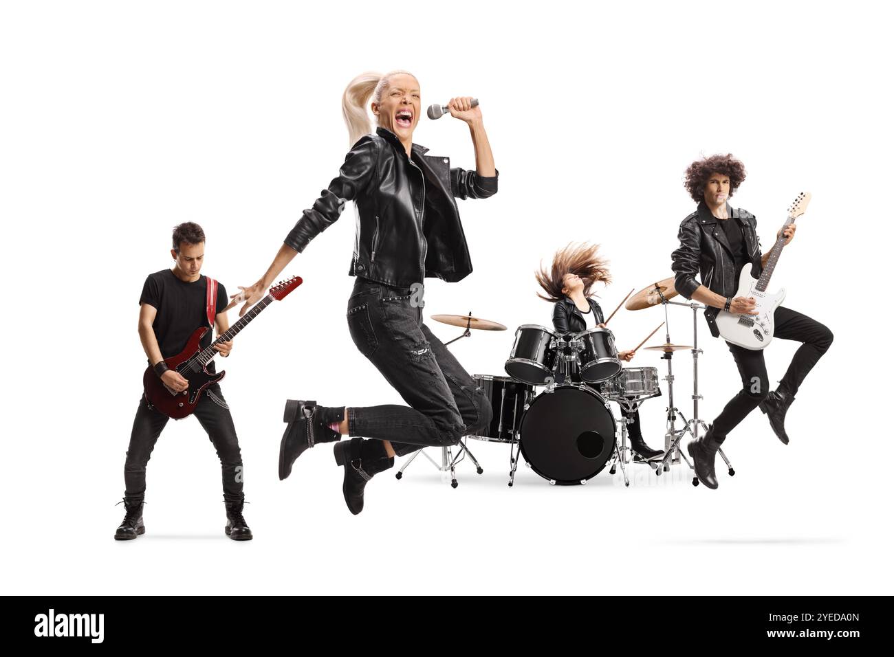 Female singer in a rock band performing with guitar players and a ...