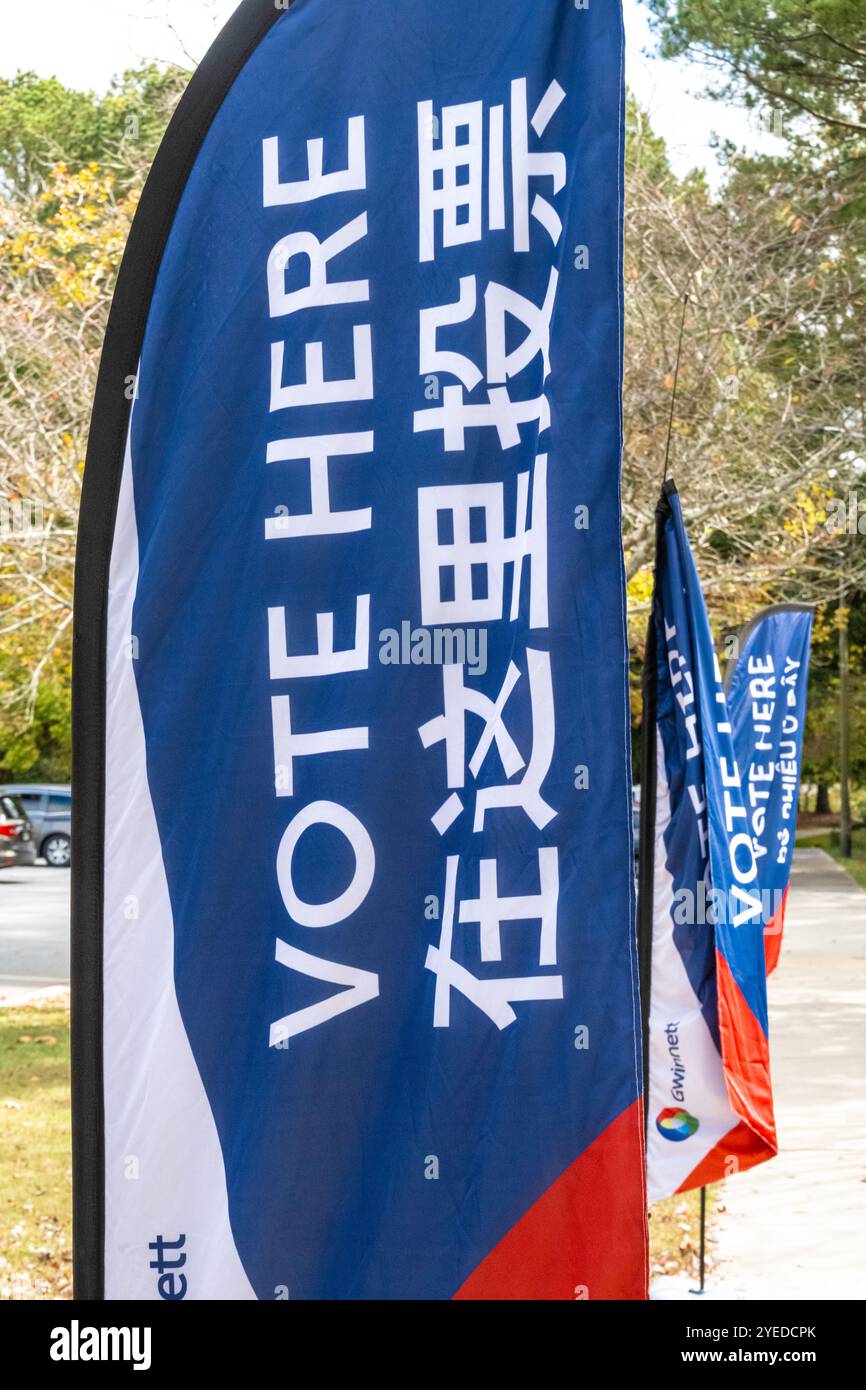 Multilingual "Vote Here" banners at a Metro Atlanta, Georgia, polling ...