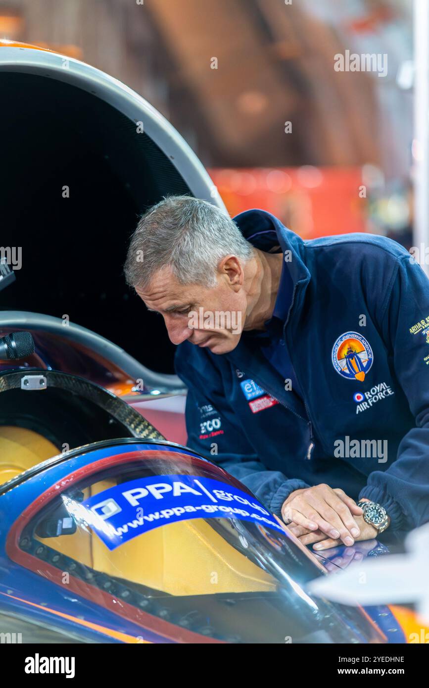 Pilot and driver Andy Green looking into cockpit of Bloodhound SSC ...