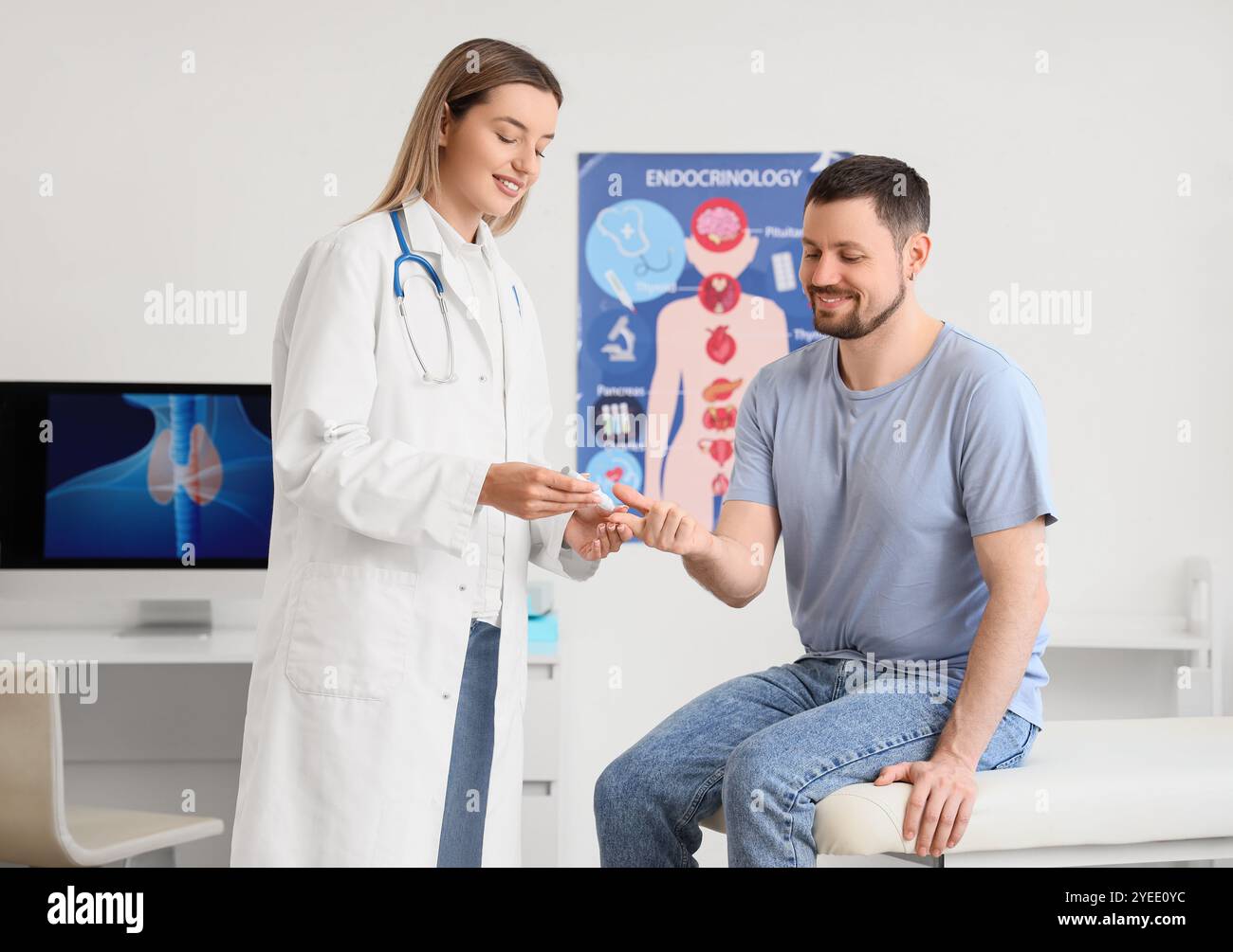 Female endocrinologist measuring blood sugar level of man in clinic ...