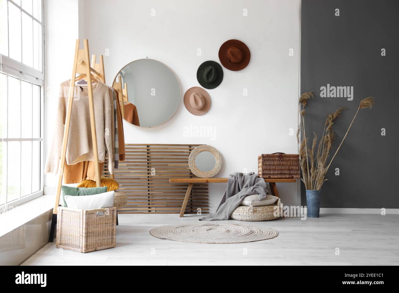 Interior of dressing room with wooden bench, clothes rack and mirrors ...