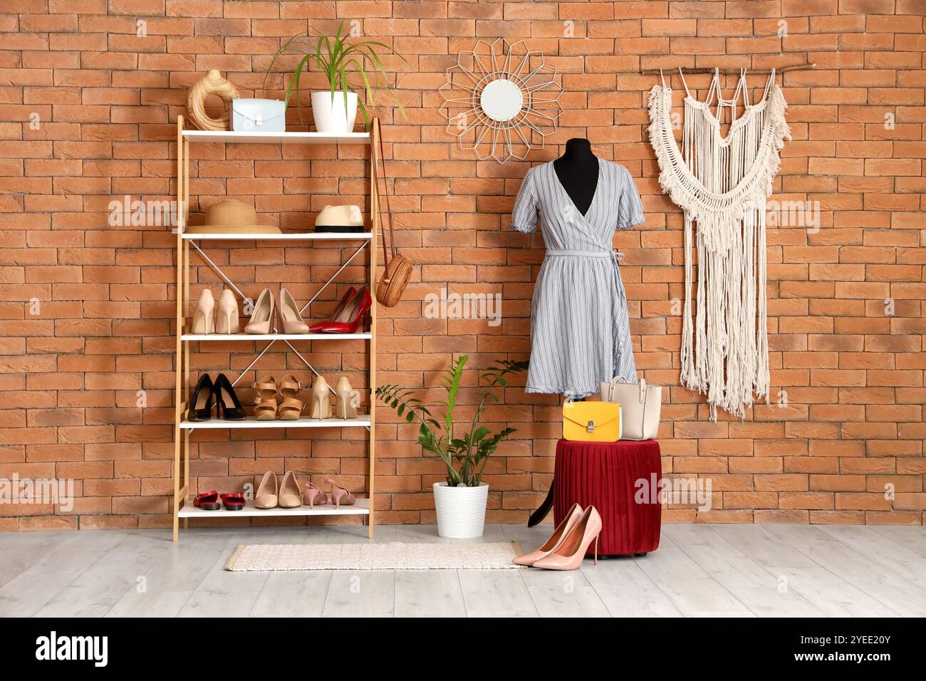 Interior of dressing room with mannequin, pouf and shelf unit Stock ...