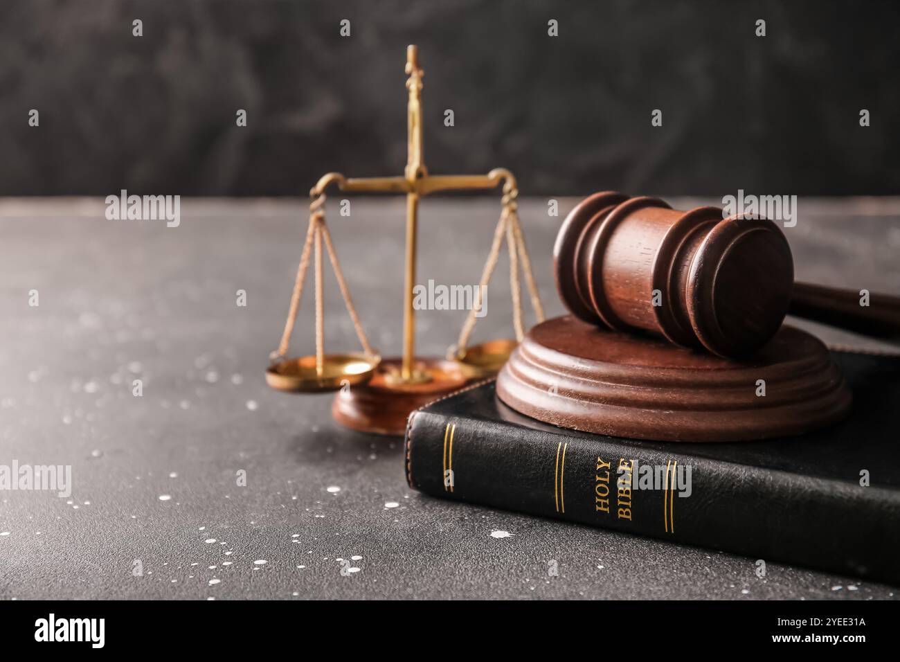 Judge's gavel, Holy Bible and justice scales on dark background Stock ...