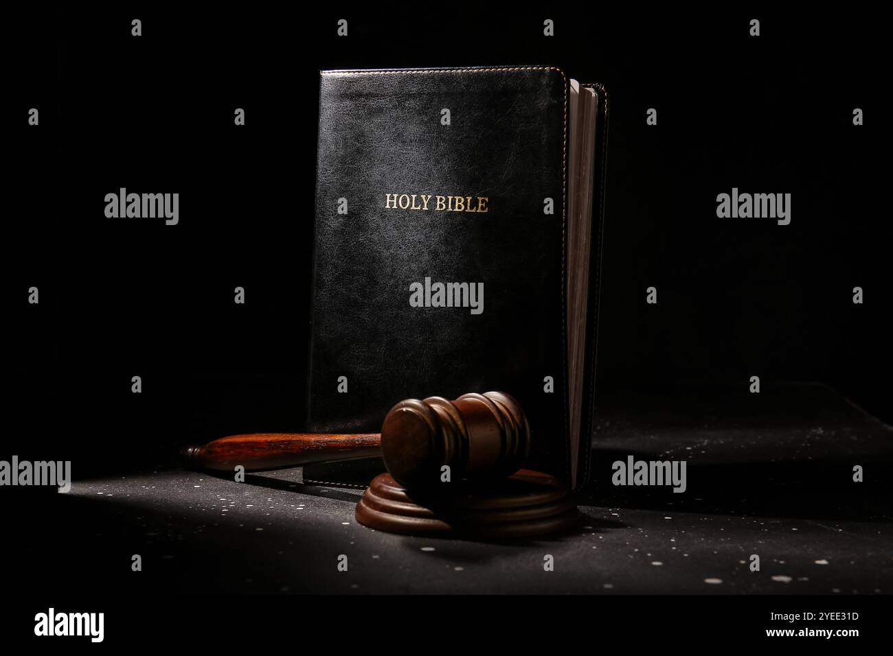 Holy Bible with judge's gavel on dark background Stock Photo - Alamy