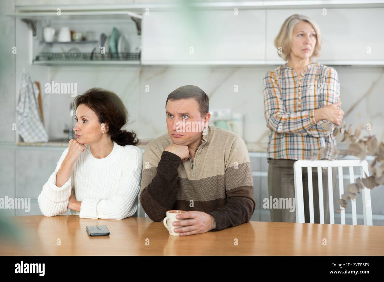 Family quarrel of three people Stock Photo - Alamy