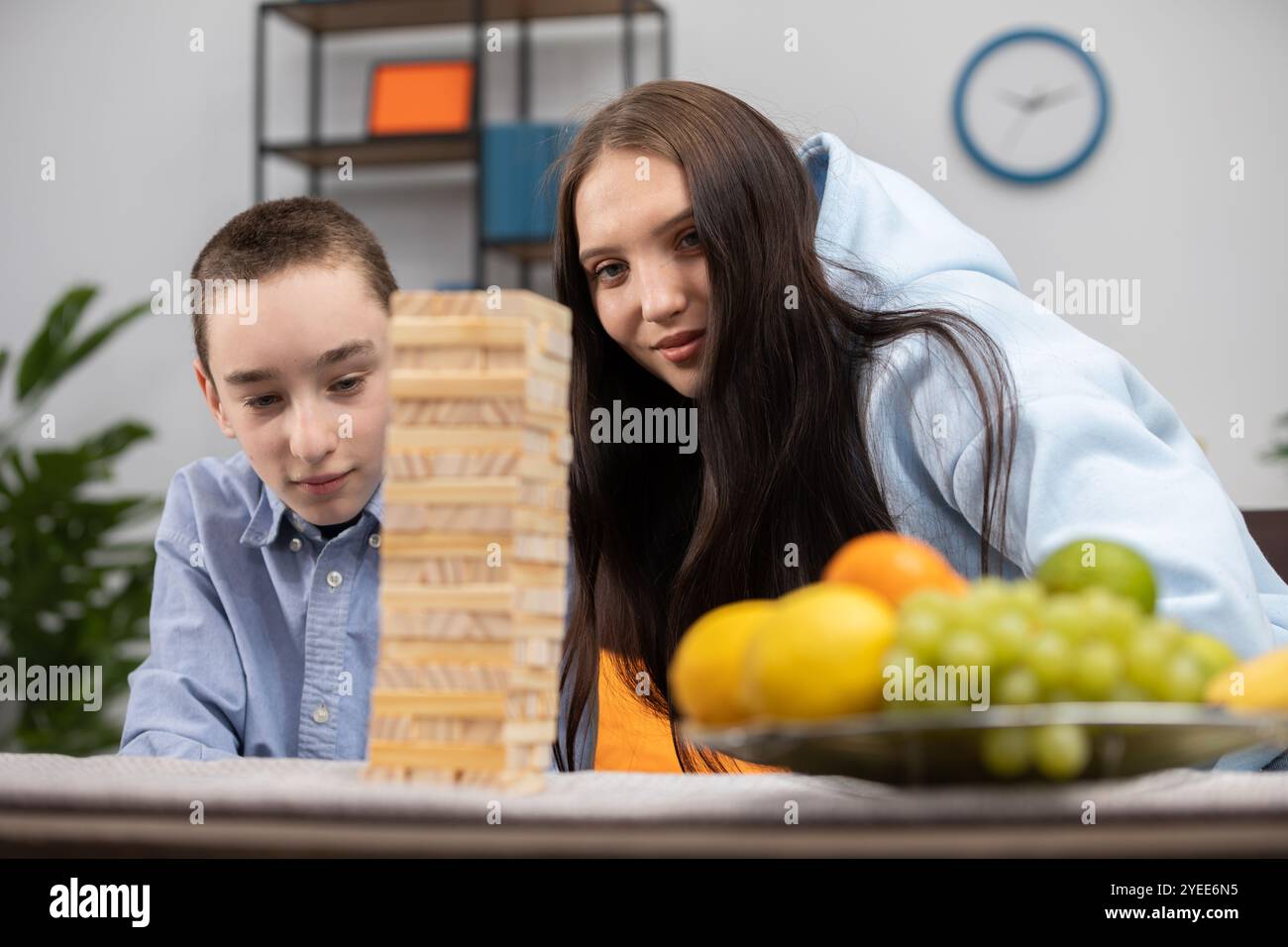 Happy friends playing jenga hi-res stock photography and images - Alamy