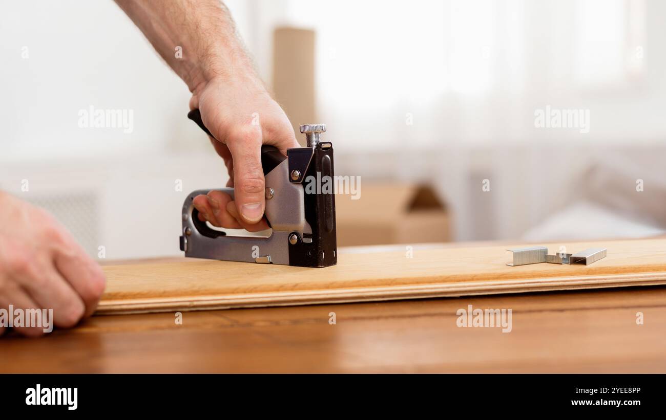 Unrecognizable Carpenter Using Staple Gun Making Furniture Indoors ...