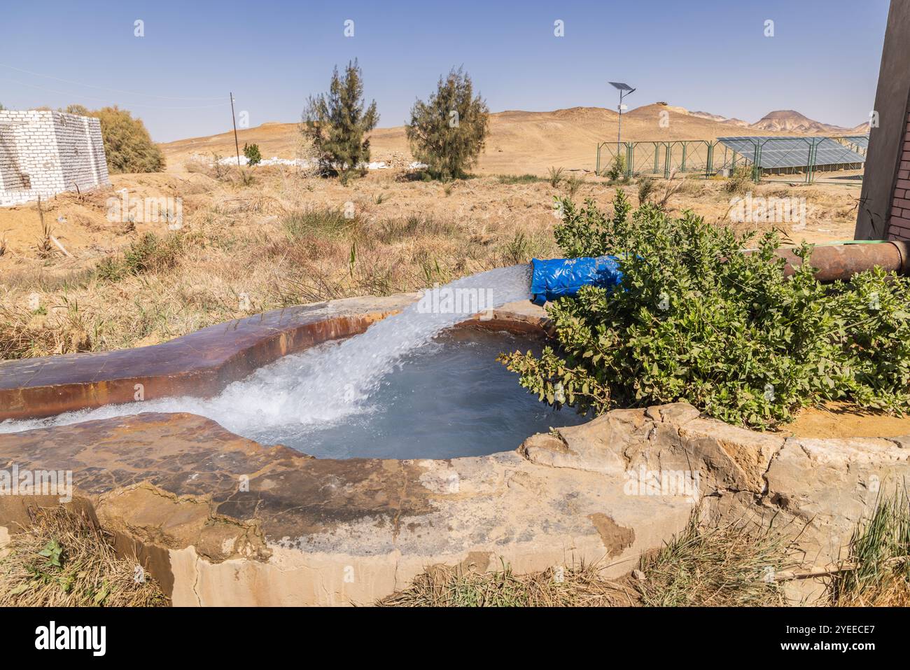 Al Wahat Al Baharia, Giza, Egypt. Water flowing into a pool at the ...