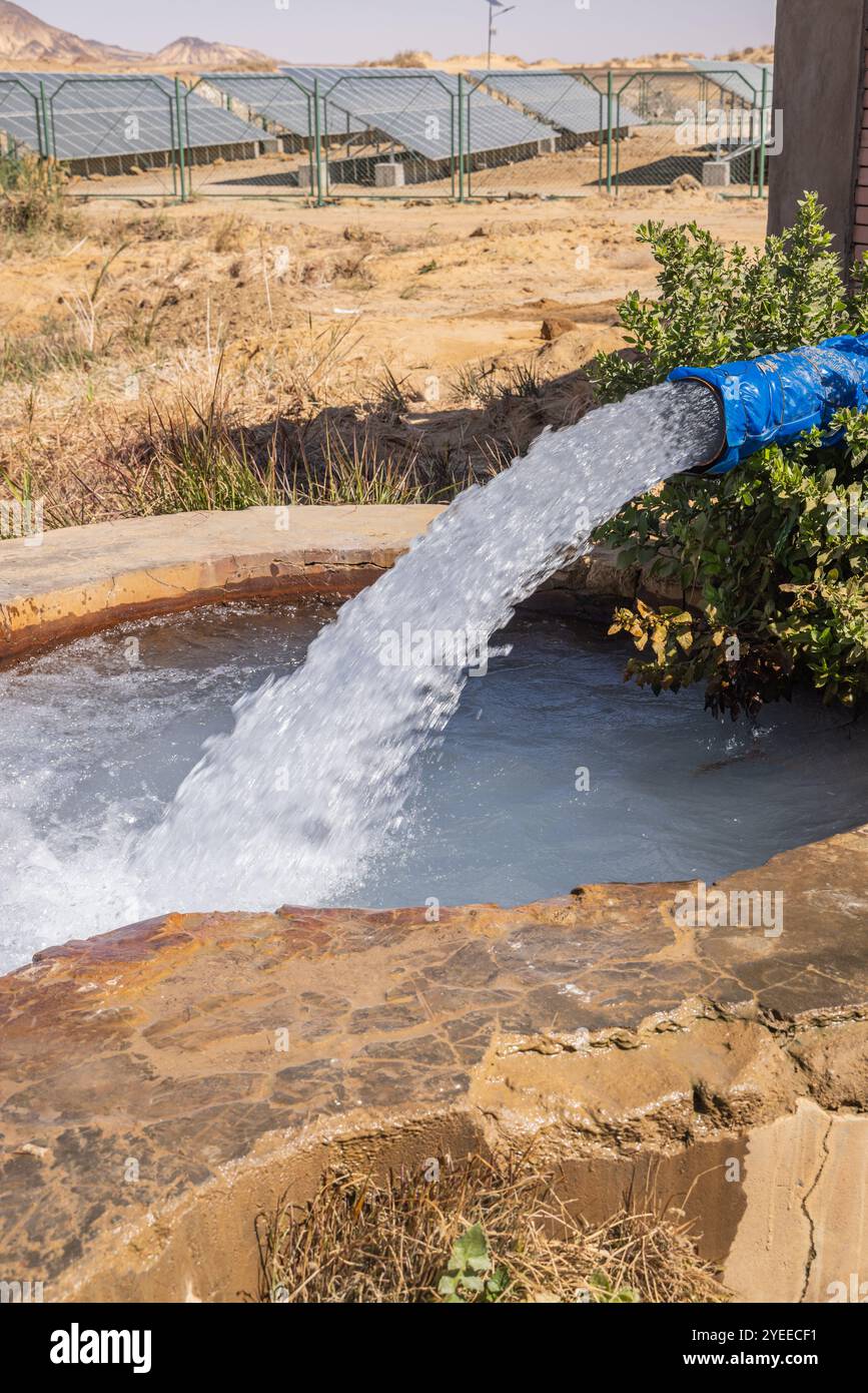 Al Wahat Al Baharia, Giza, Egypt. Water flowing into a pool at the ...